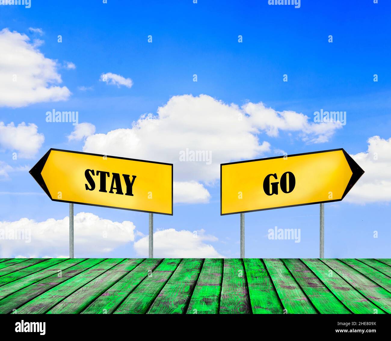 Two street signs STAY and GO with beautiful blue sky with cloud closeup ...