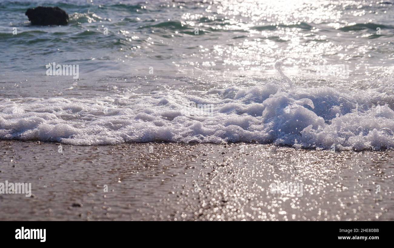 sea surf in the red sea on a sandy beach. wave close-up Stock Photo - Alamy
