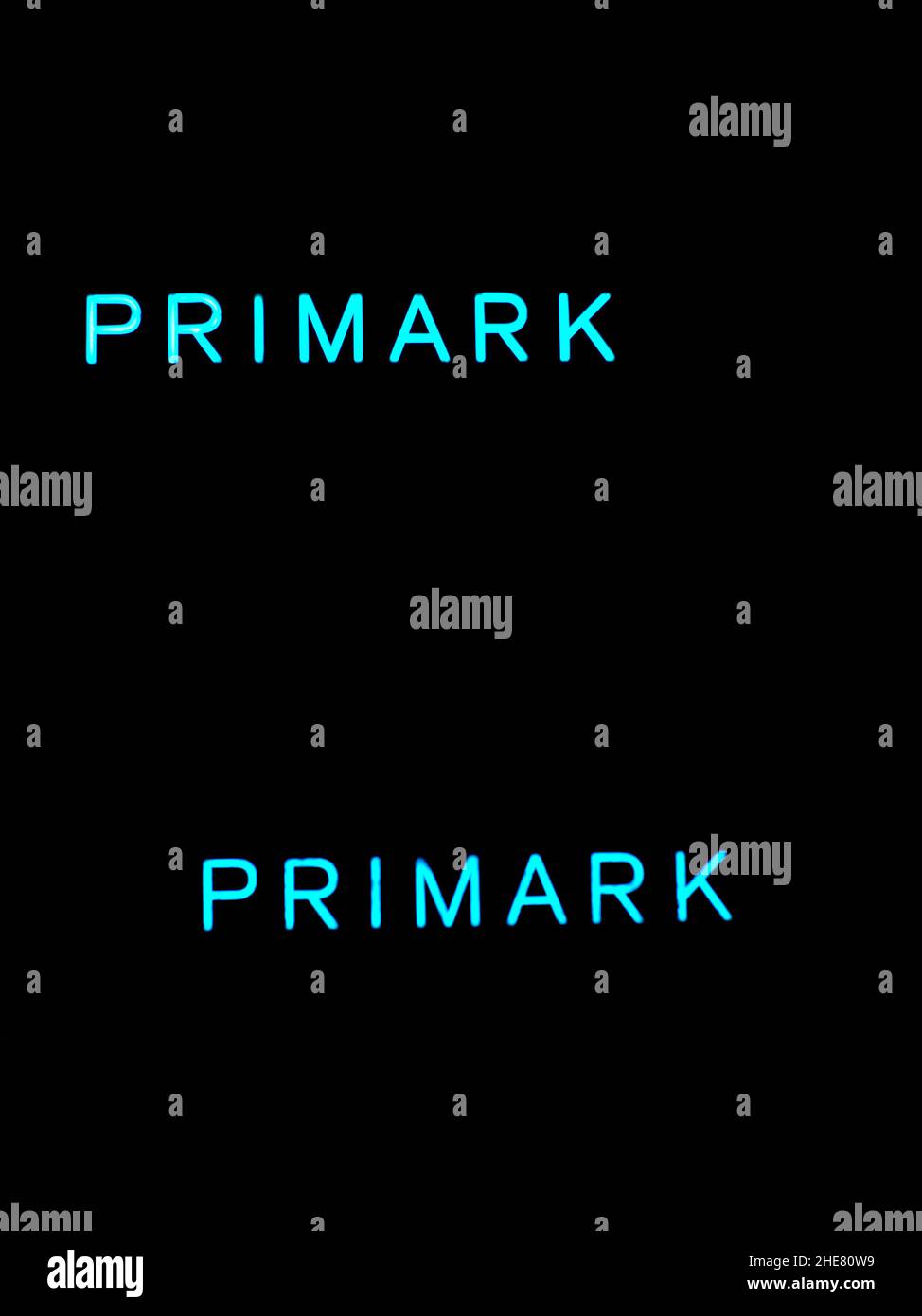 Seville, Spain; January 4th, 2021: Night photo of two PRIMARK neon ...