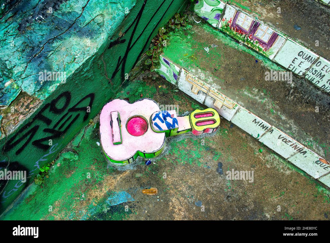 Small guitar painting on a stair in the Batman Alley. The 'Beco de ...