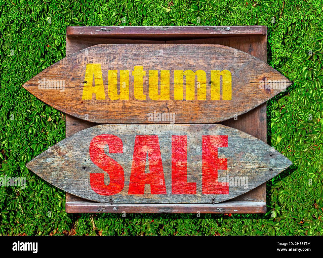 SALE Wooden old sign hanged on background Stock Photo - Alamy