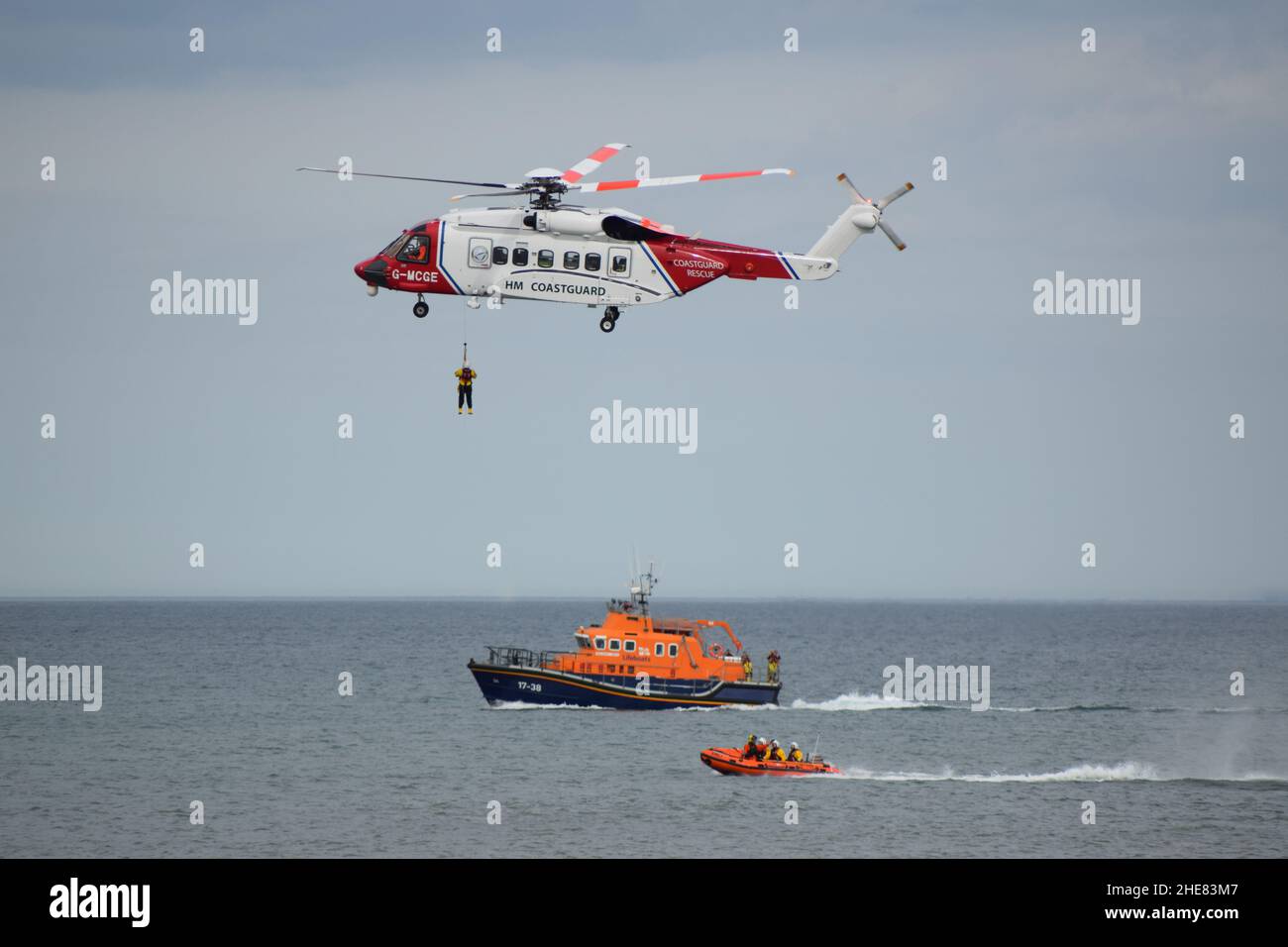 Uk Hm Coastguard Helicopter In Training Manoeuvres With Rnli Humber Lifeboat And Withernsea Rnli
