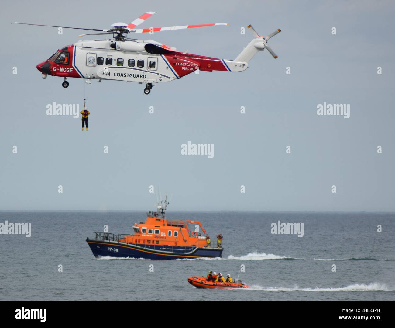 UK HM Coastguard Helicopter in training manoeuvres with RNLI Humber ...