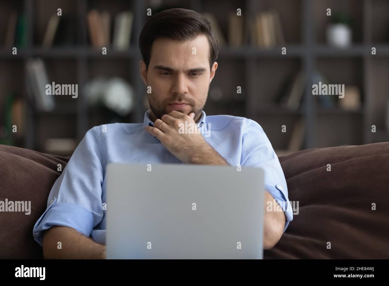 Confused student looking laptop screen hi-res stock photography and ...