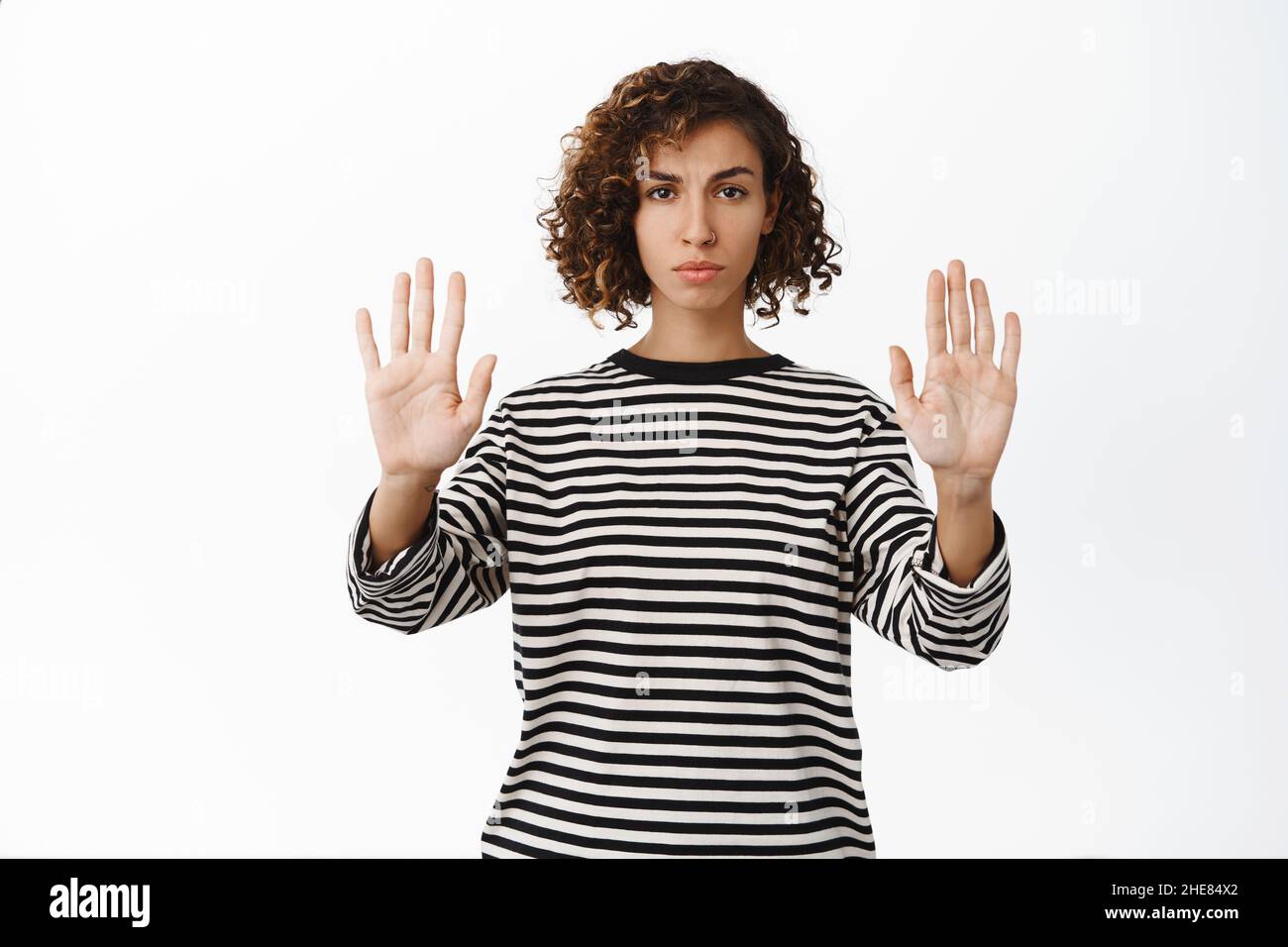 Stop. Serious and concerned young woman disapprove, prohibit action ...