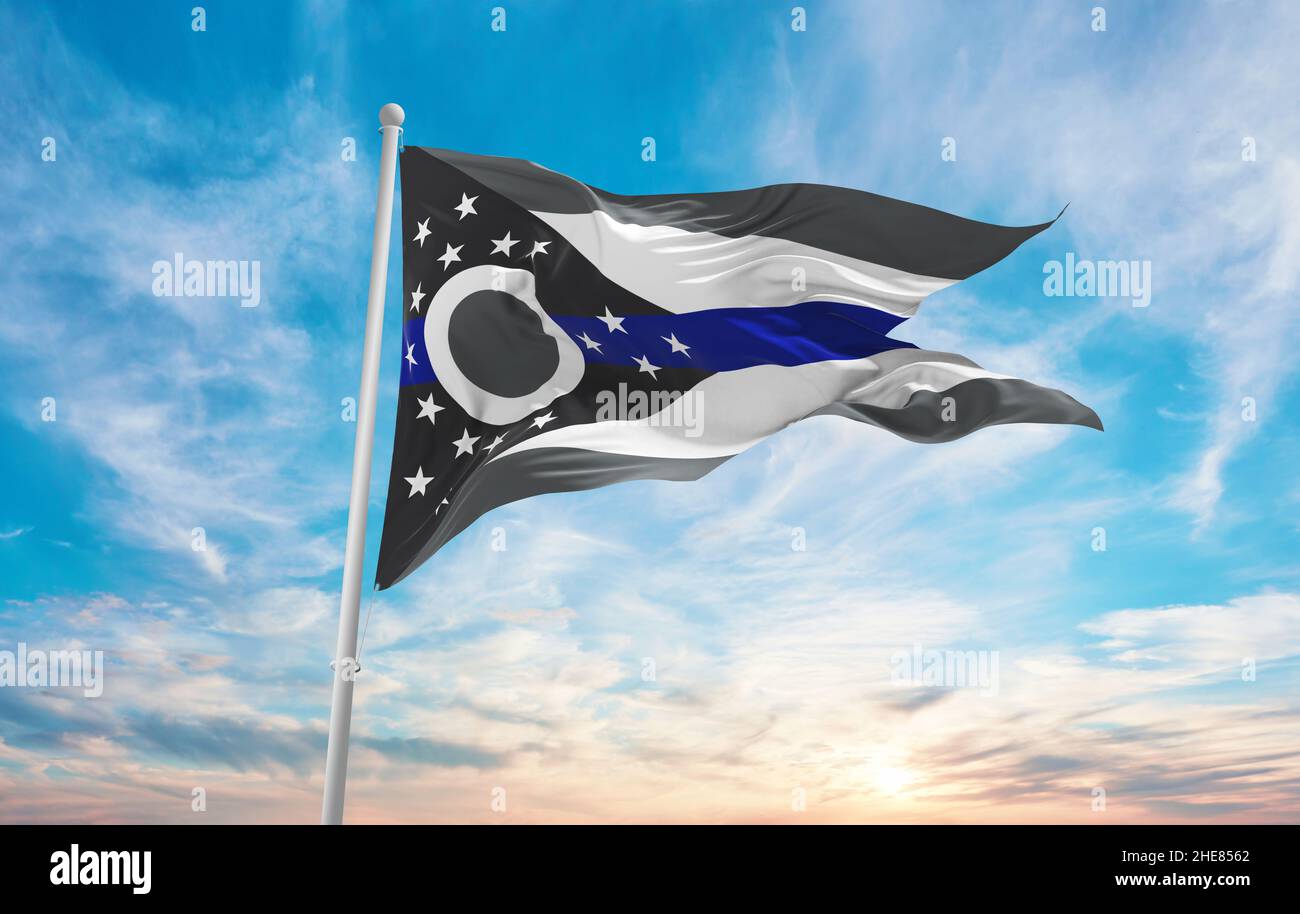 blue line flag of Ohio state, Usa at cloudy sky background on sunset ...