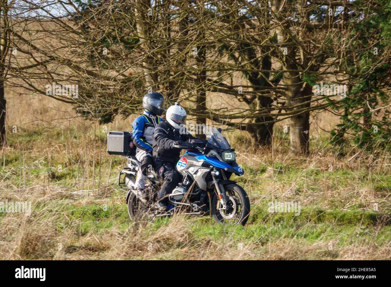 motorbike rider and pillion passenger on a BMW R1200 GS motorcycle ...