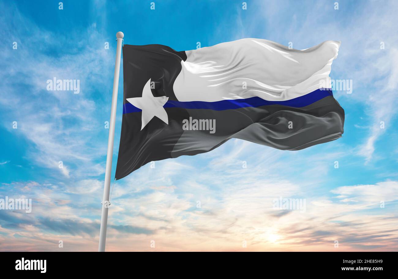 blue line flag of Texas state, Usa at cloudy sky background on sunset ...