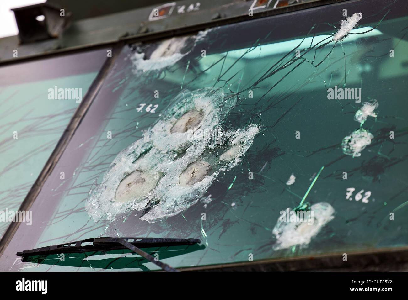 Armored glass after of a direct hit from an automatic weapon. Safety ...