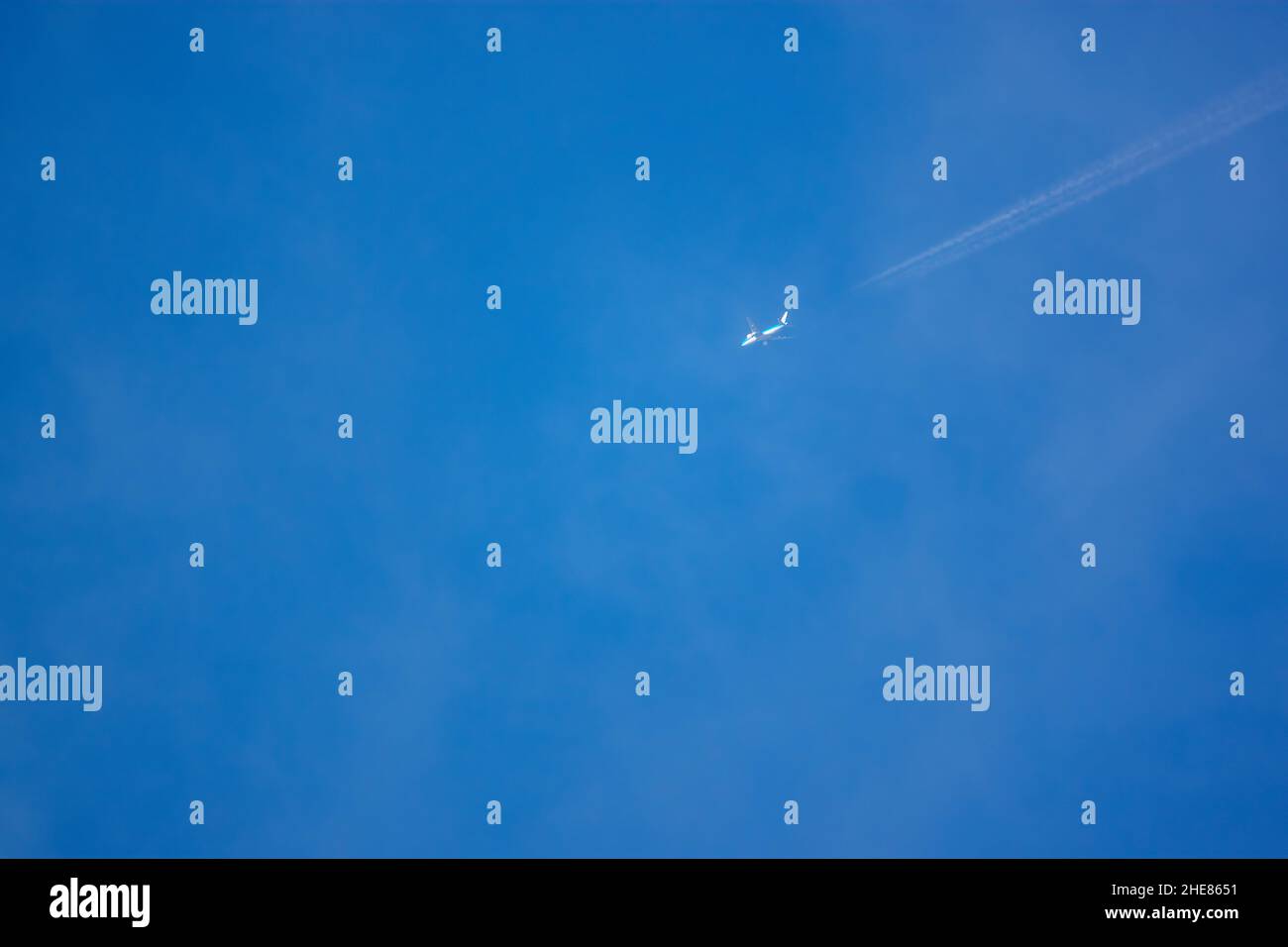 high altitude contrails from a KLM Boeing 787-10 dreamliner en route to ...