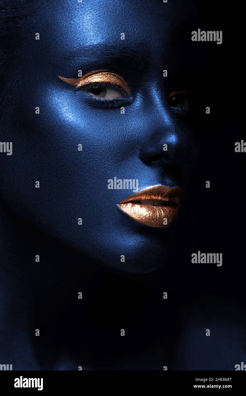 fashion portrait of a blue-skinned girl with color make-up. Beauty face ...