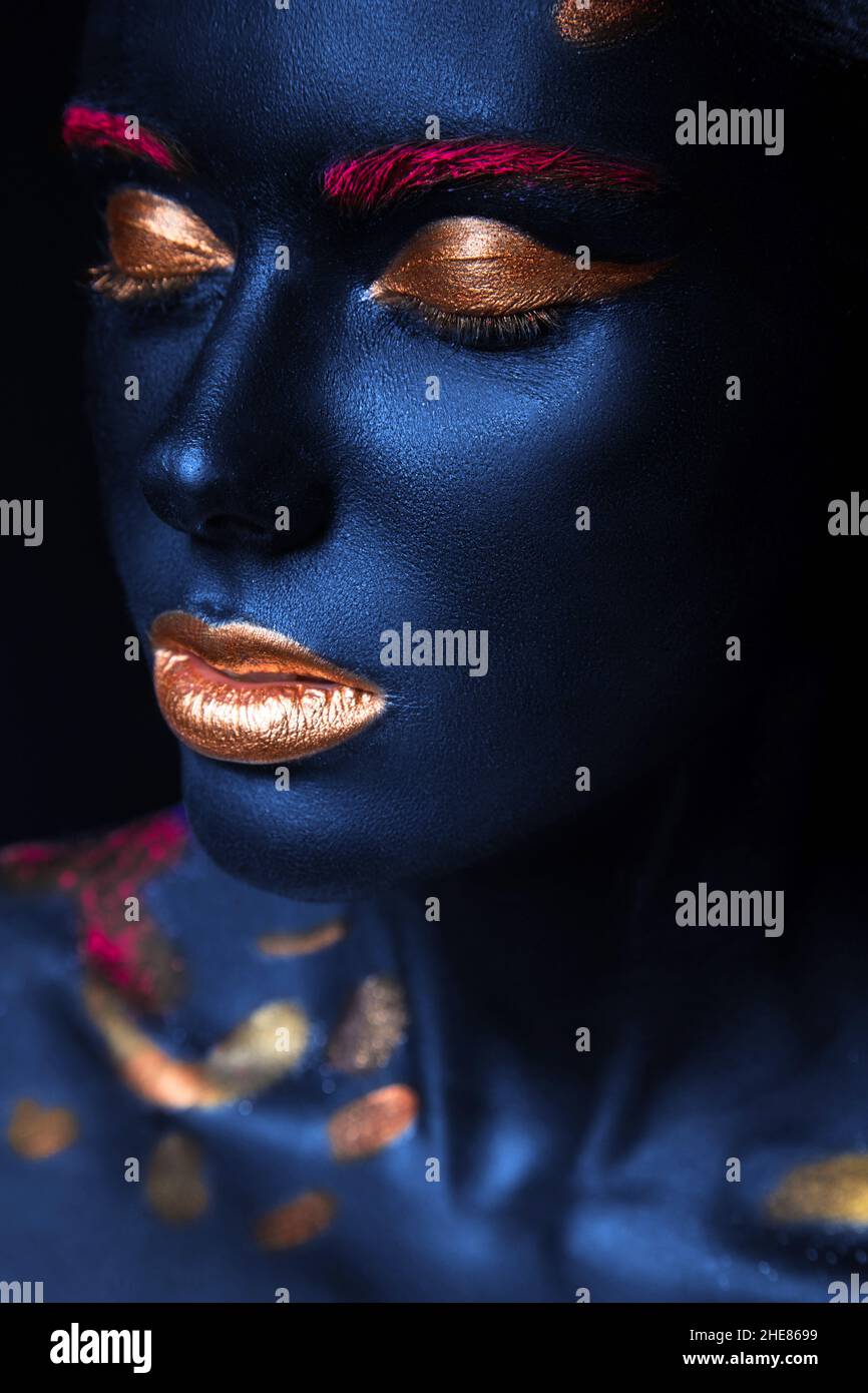 fashion portrait of a blue-skinned girl with color make-up. Beauty face ...