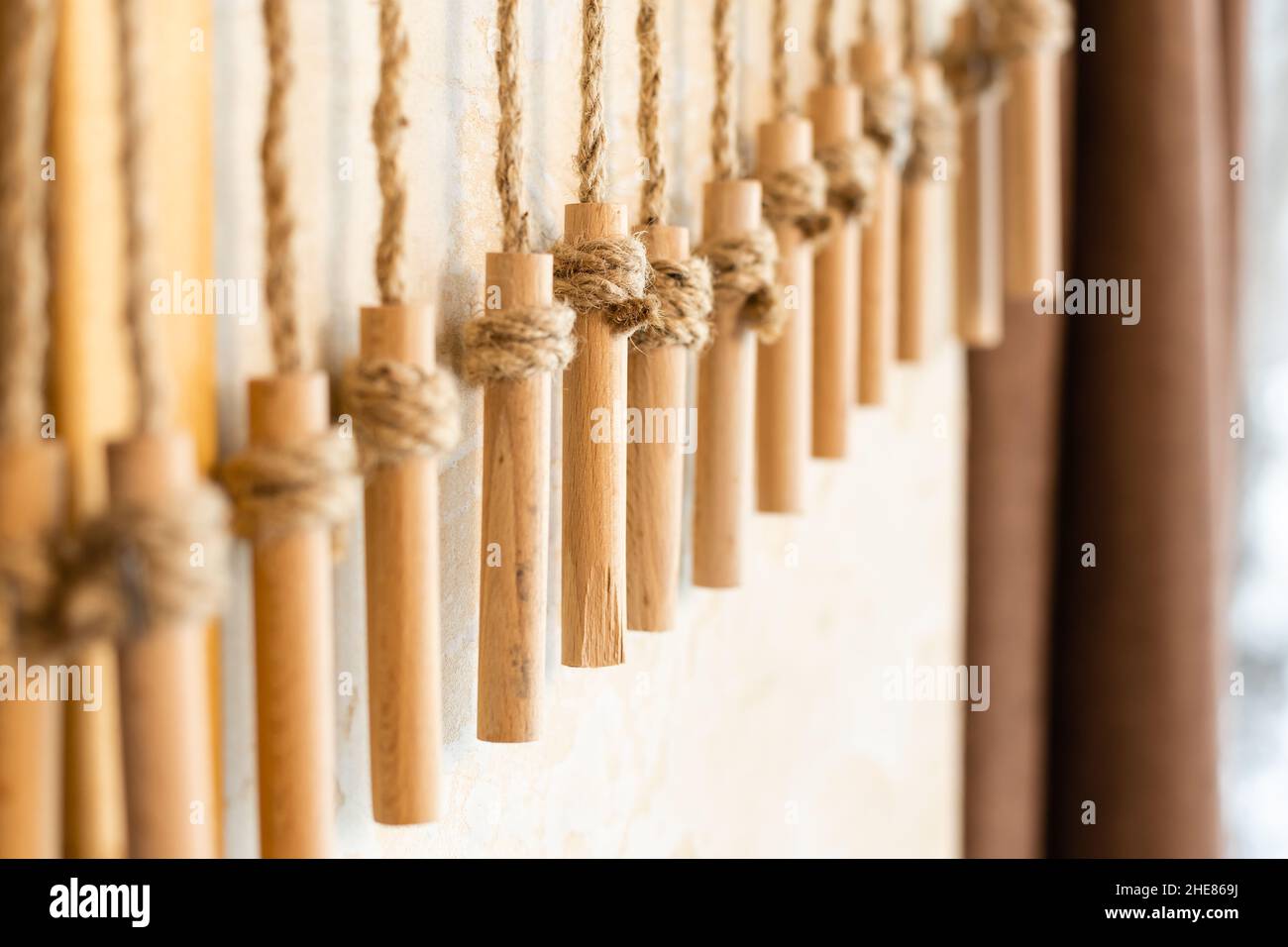 wooden handles hang on a rope, decor Stock Photo - Alamy