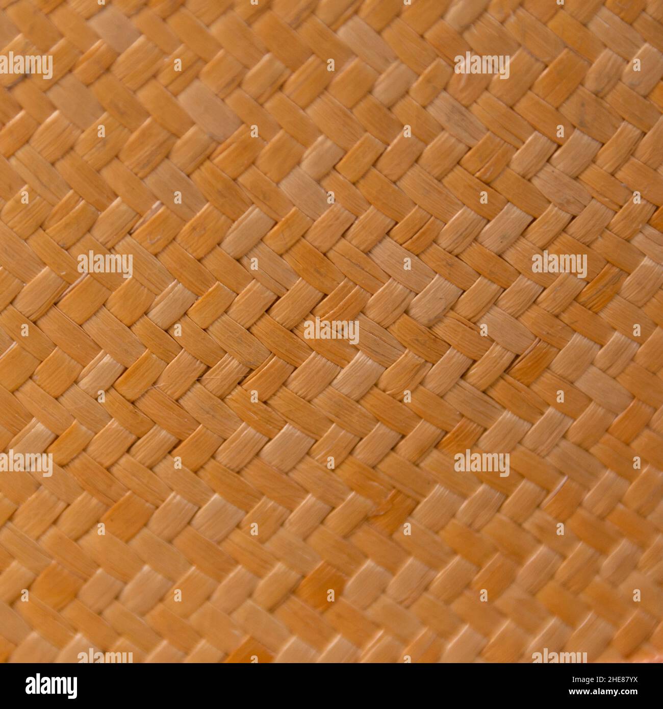 Fragment of dense and hard fabric made of light and dark yellow ...