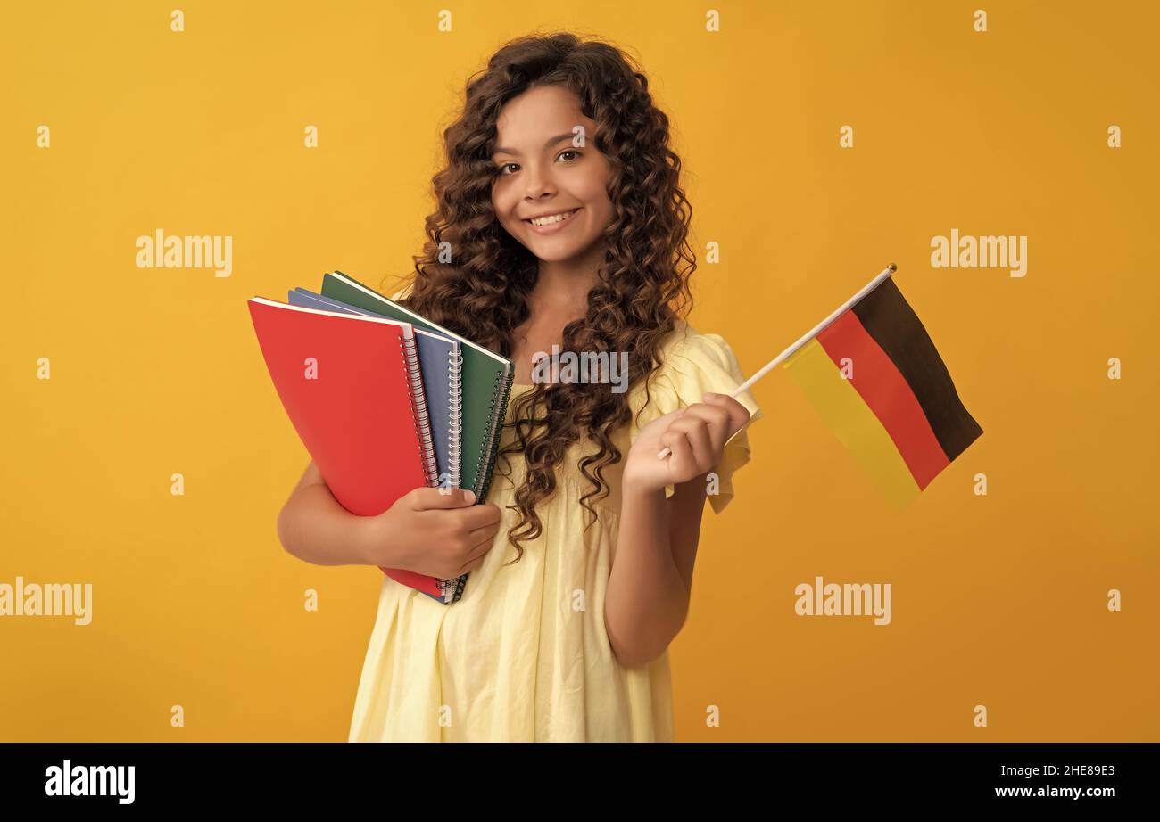 german language. child hold flag. back to school. teen girl study in ...
