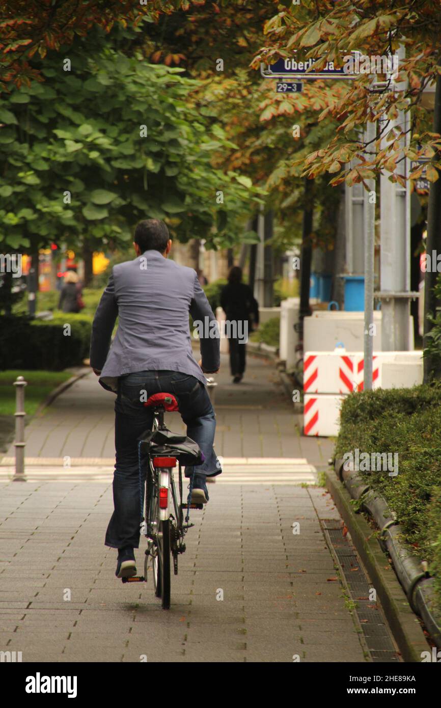 Adult caucasian male riding bike hi-res stock photography and images ...