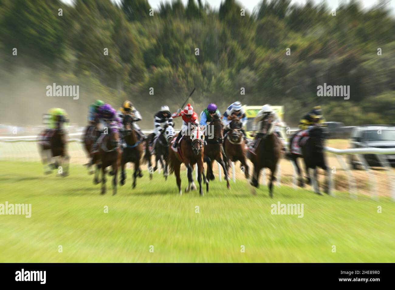 KUMARA, NEW ZEALAND, JANUARY 8, 2022; jockeys ride their mounts hard to ...