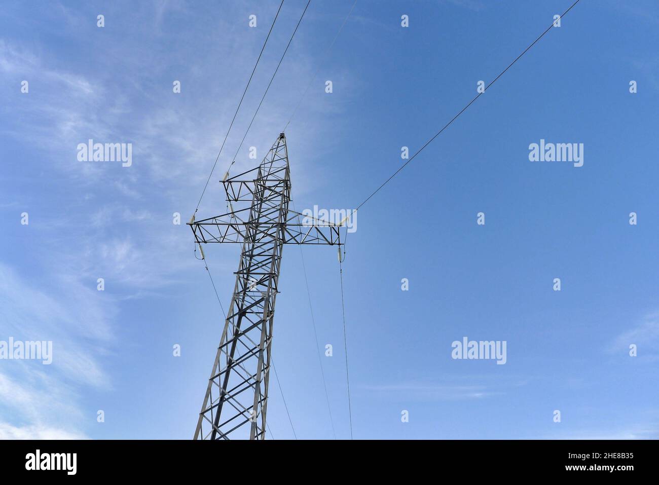 Electricity transmission pylon view against the blue sky Stock Photo ...