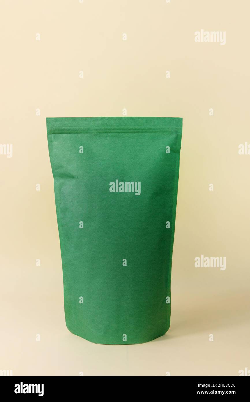 Green pouch bag mockup neutral beige background monochrome. Blank ...