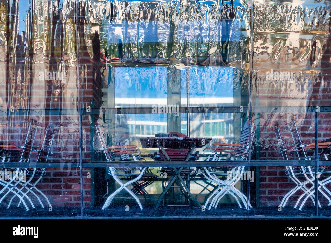 Terrace Of Restaurant Behind Plastic Tarp Stock Photo - Alamy