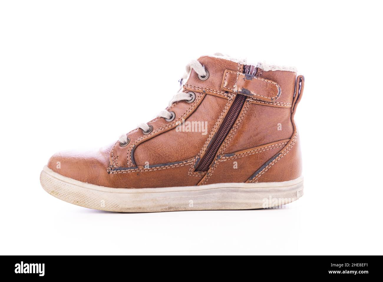 Old & dirty used shoe isolated on white background Stock Photo - Alamy