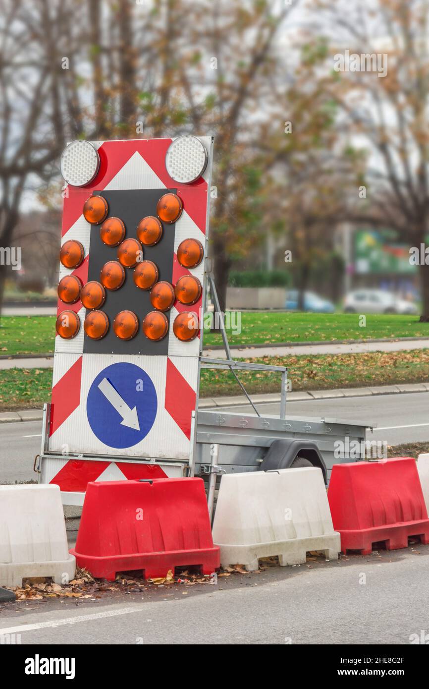 Road maintenance under construction direction sign on street Stock ...