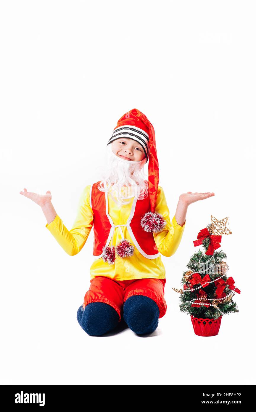 A baby dressed as a elf. isolated. Santa's helper. boy in suit of dwarf ...