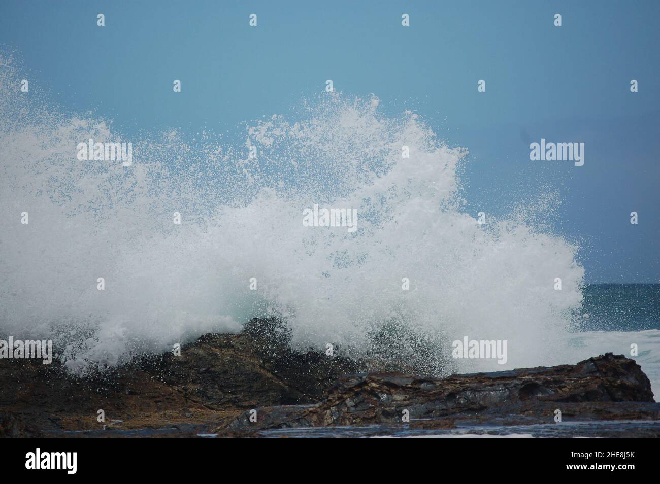 Wave Crashing onto a rock during a cyclone Stock Photo - Alamy