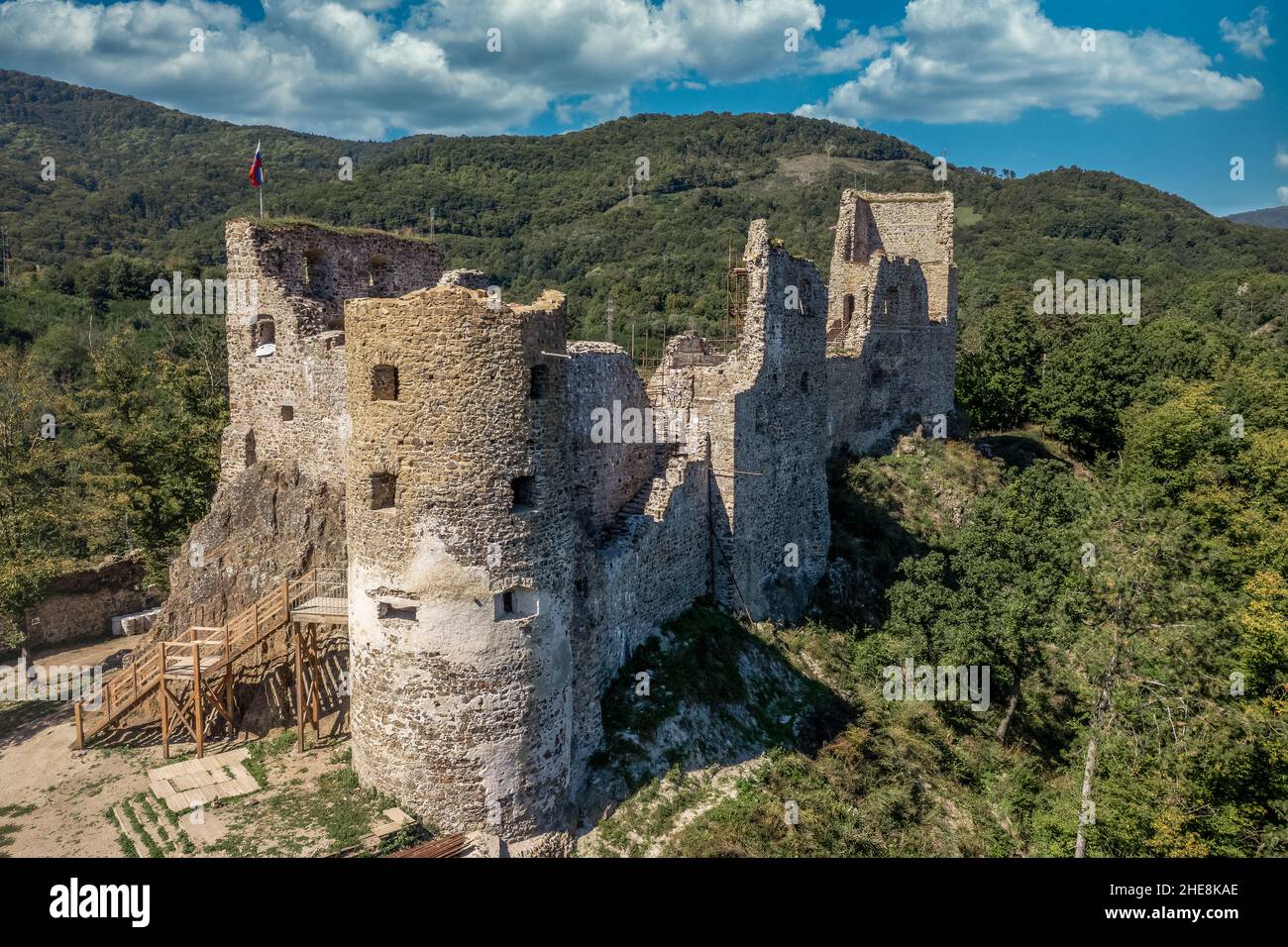 Aerial view of under restoration medieval Reviste castle above the Hron (Garam) river in ...