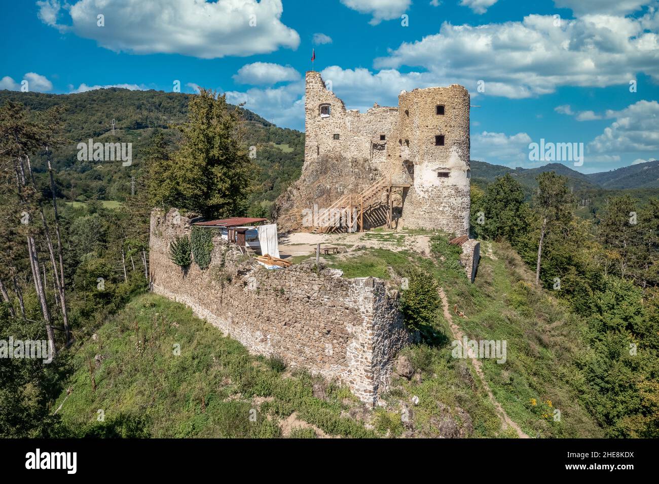 Aerial view of under restoration medieval Reviste castle above the Hron (Garam) river in ...