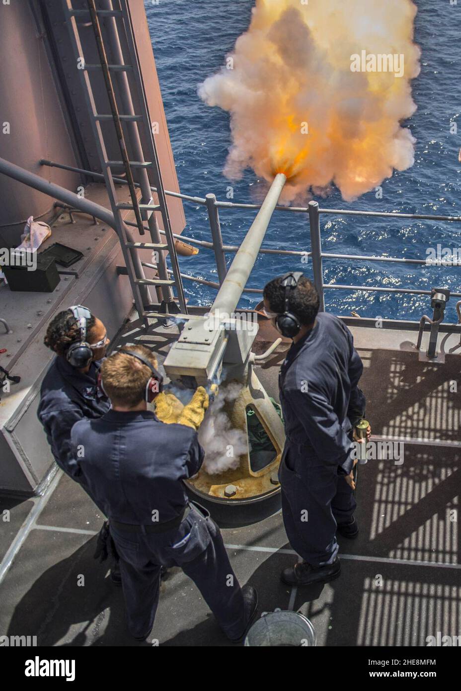 Saluting gun is fired aboard USS Essex (LHD-2) in June 2015 Stock Photo ...