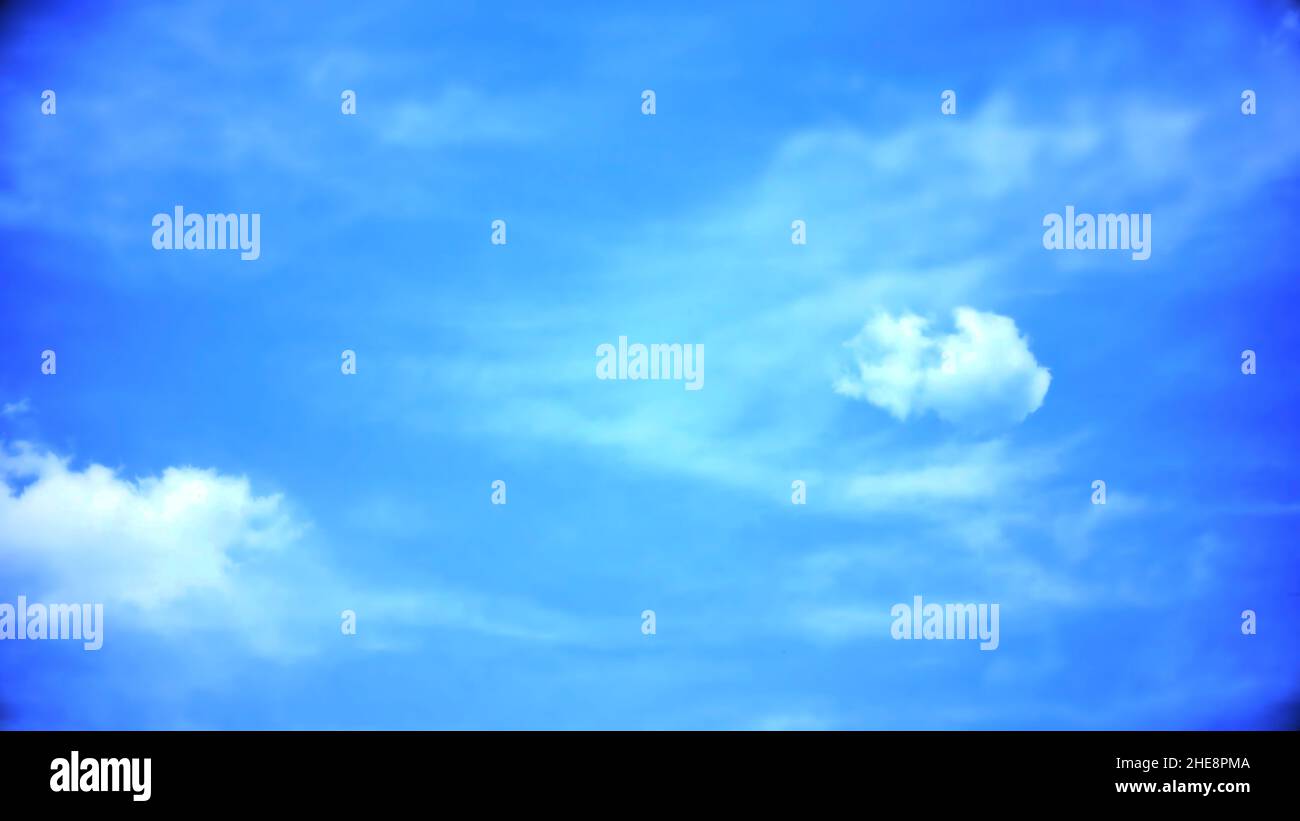 White clouds flying blue sky time lapse. Dark storm clouds are moving ...