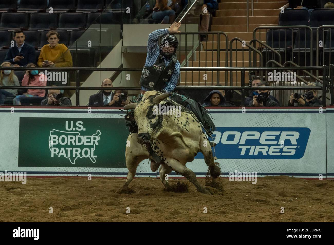 Conner Halverson rides Grave Robber during the Professional Bull Riders ...
