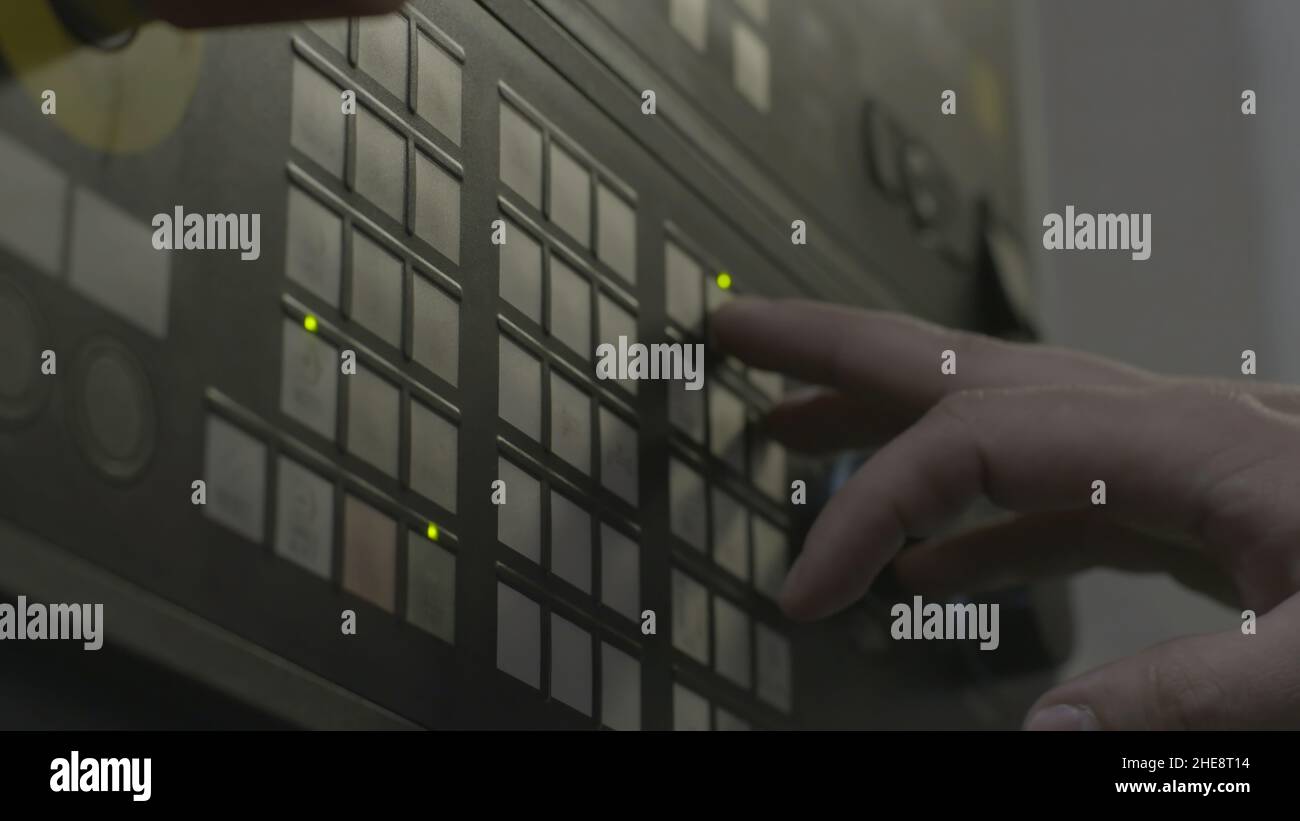 Machine operator presses buttons cnc hi-res stock photography and ...