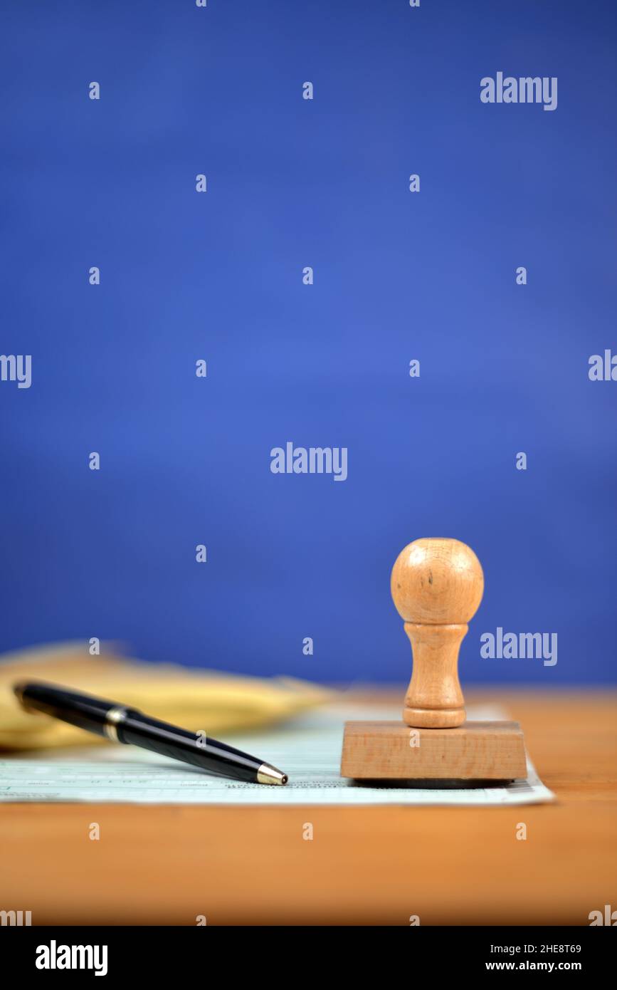 Papers contract and stamp on a desk with blue background Stock Photo ...