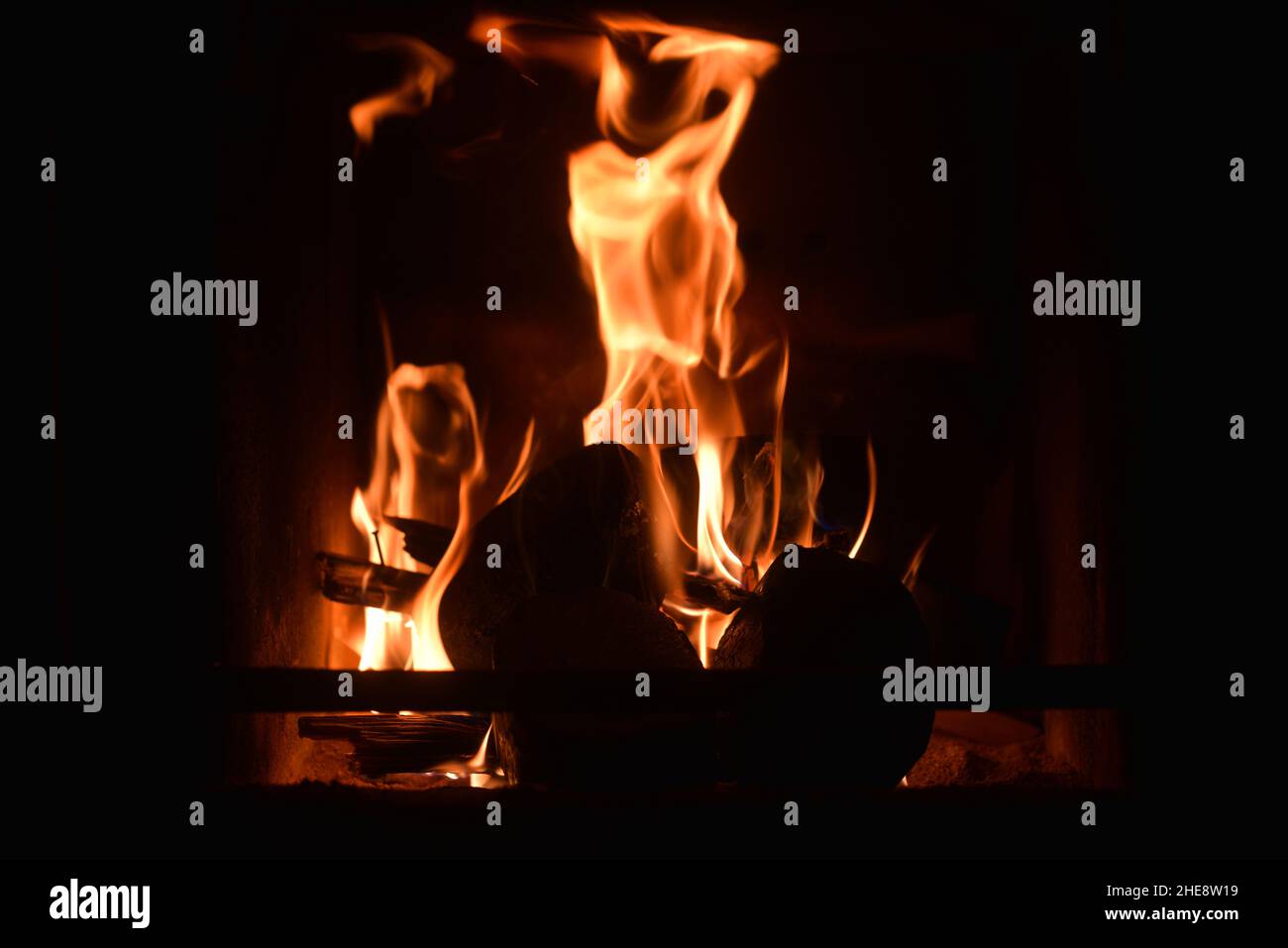 Flames in a fireplace with wood and coal burning Stock Photo - Alamy