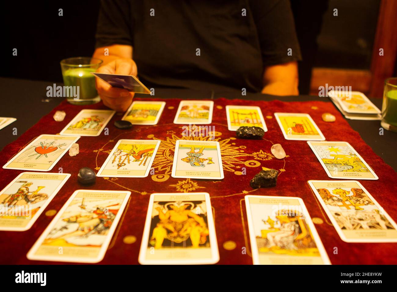 Occult mystic tarot deck and old tarot cards laying on table for a ...