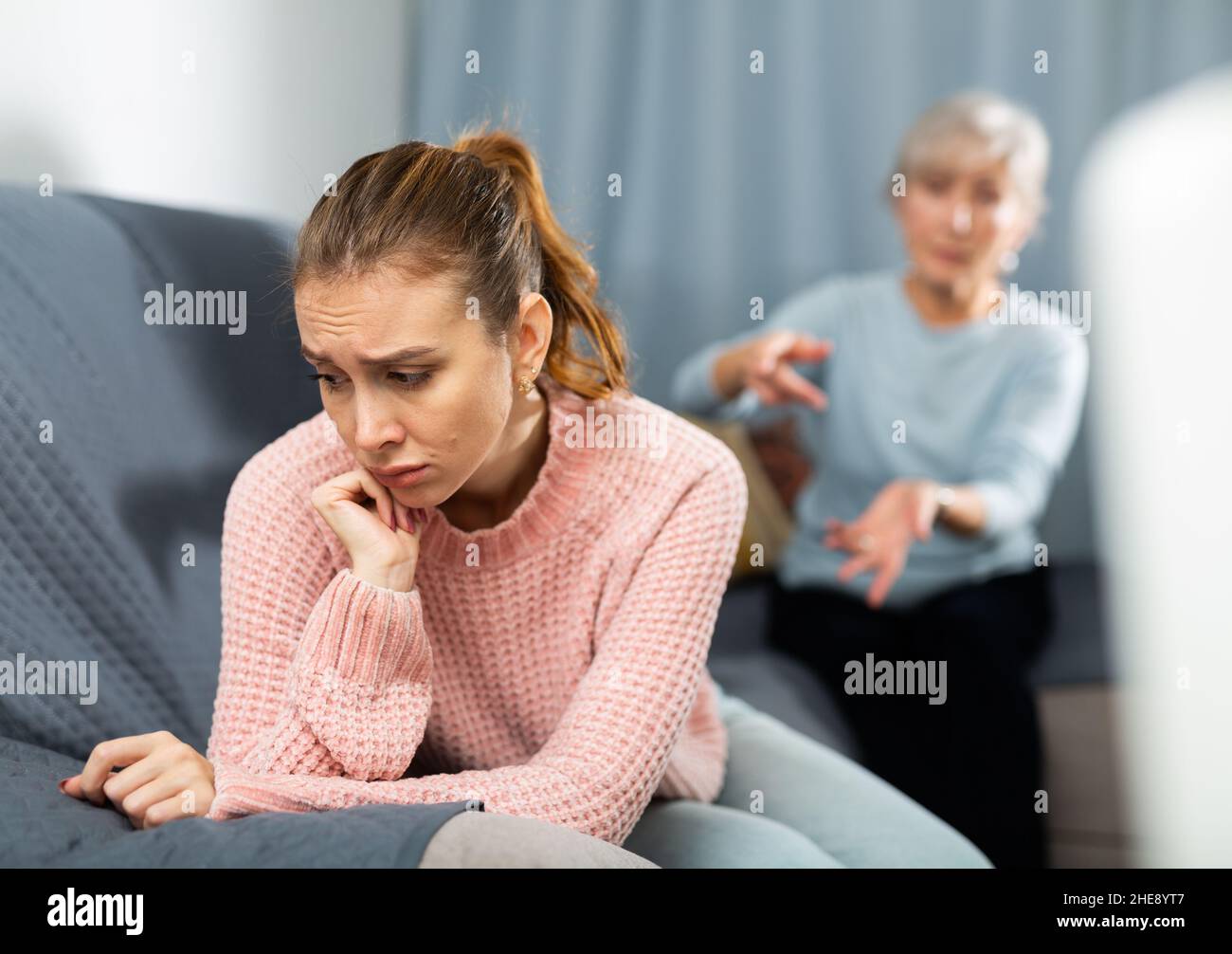Sad woman and her senior mother Stock Photo - Alamy
