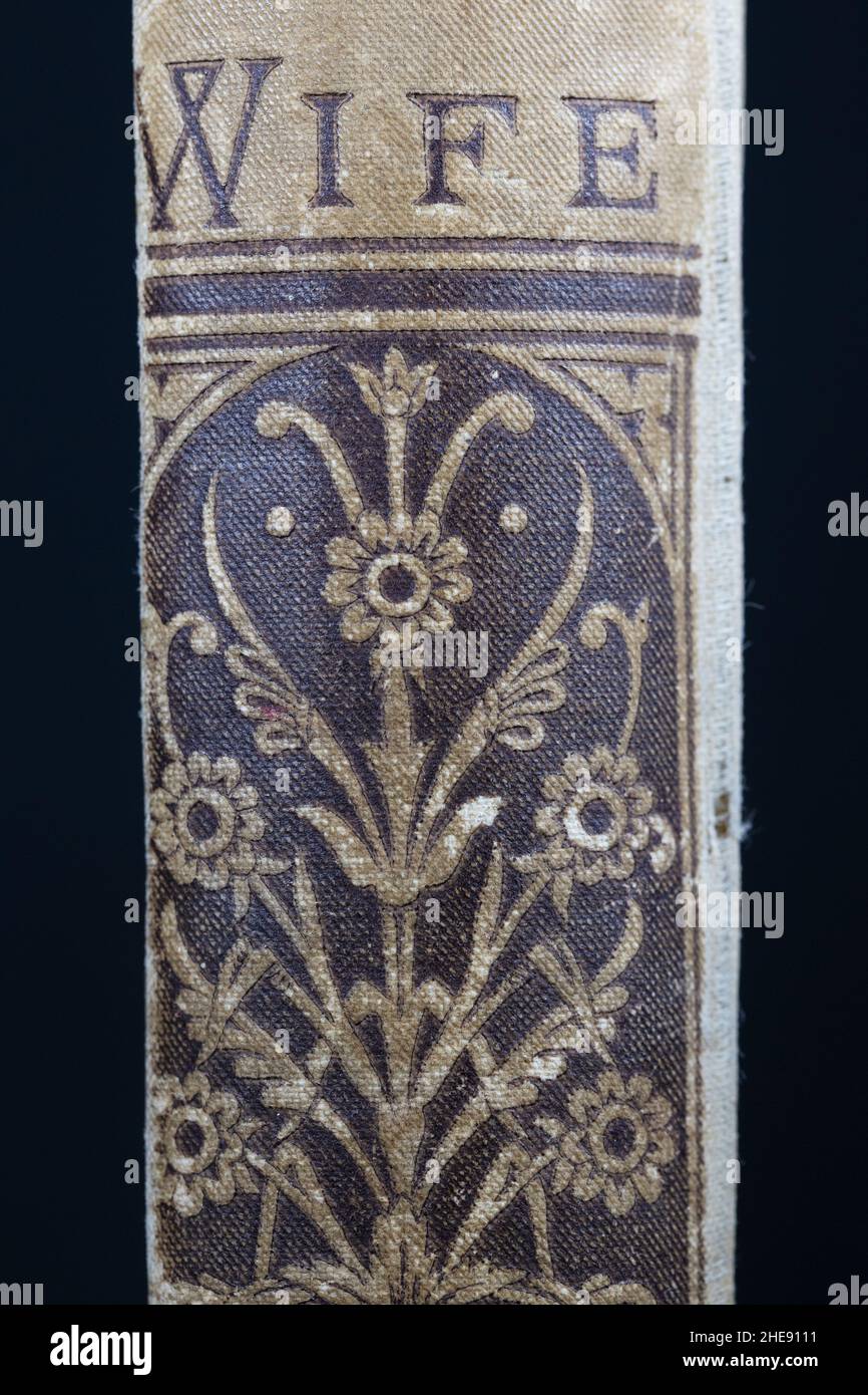 The spine of a vintage hardback book with the word "wife" and a floral ...