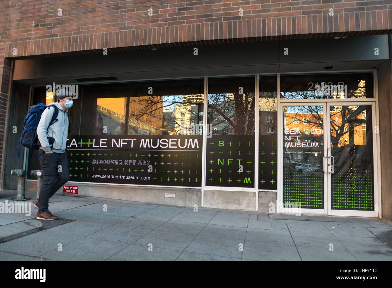 Seattle, USA. 9 Jan, 2022. A person passing Seattle’s new NFT museum in ...