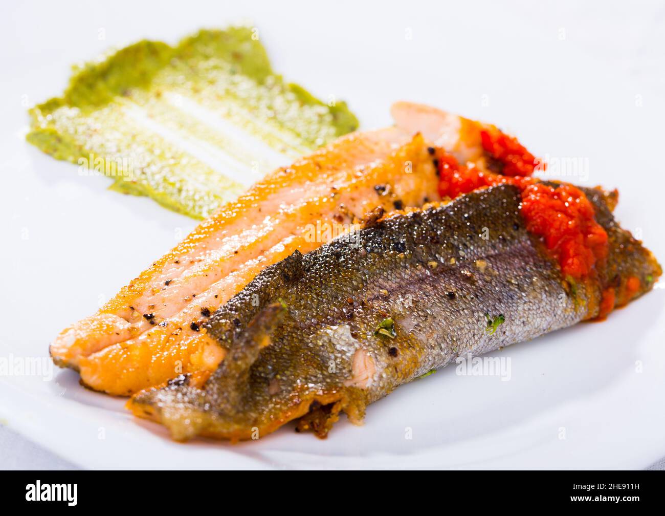 Fried trout fillets with sauces Stock Photo - Alamy