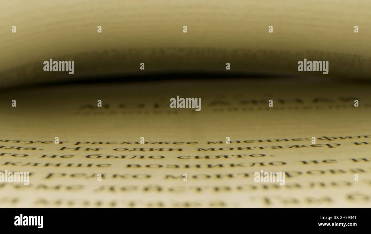 Close up of an open book with a gap between two pages. Camera moving ...