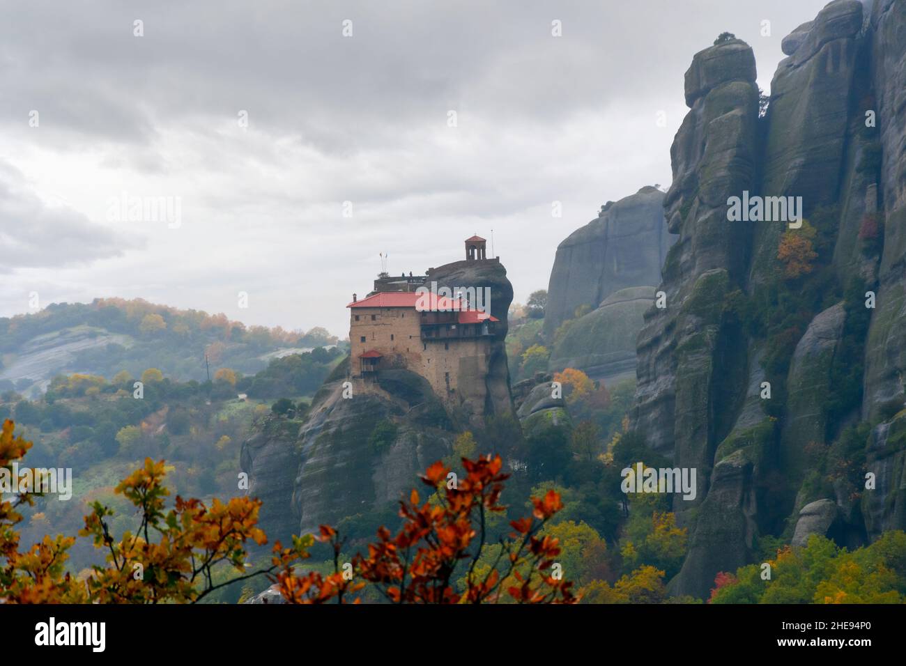 Holy Monastery of St. Nicholas Anapafsasat Meteora, Greece under foggy ...