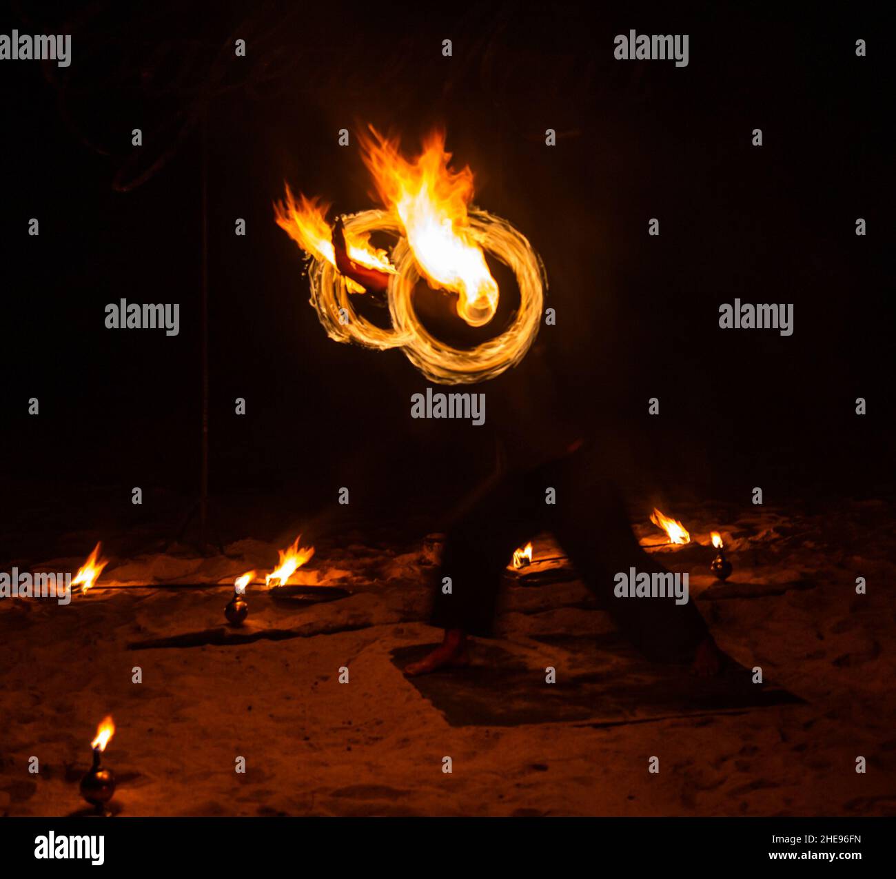 Fire show on the beach at night in Phuket, Thailand Stock Photo - Alamy