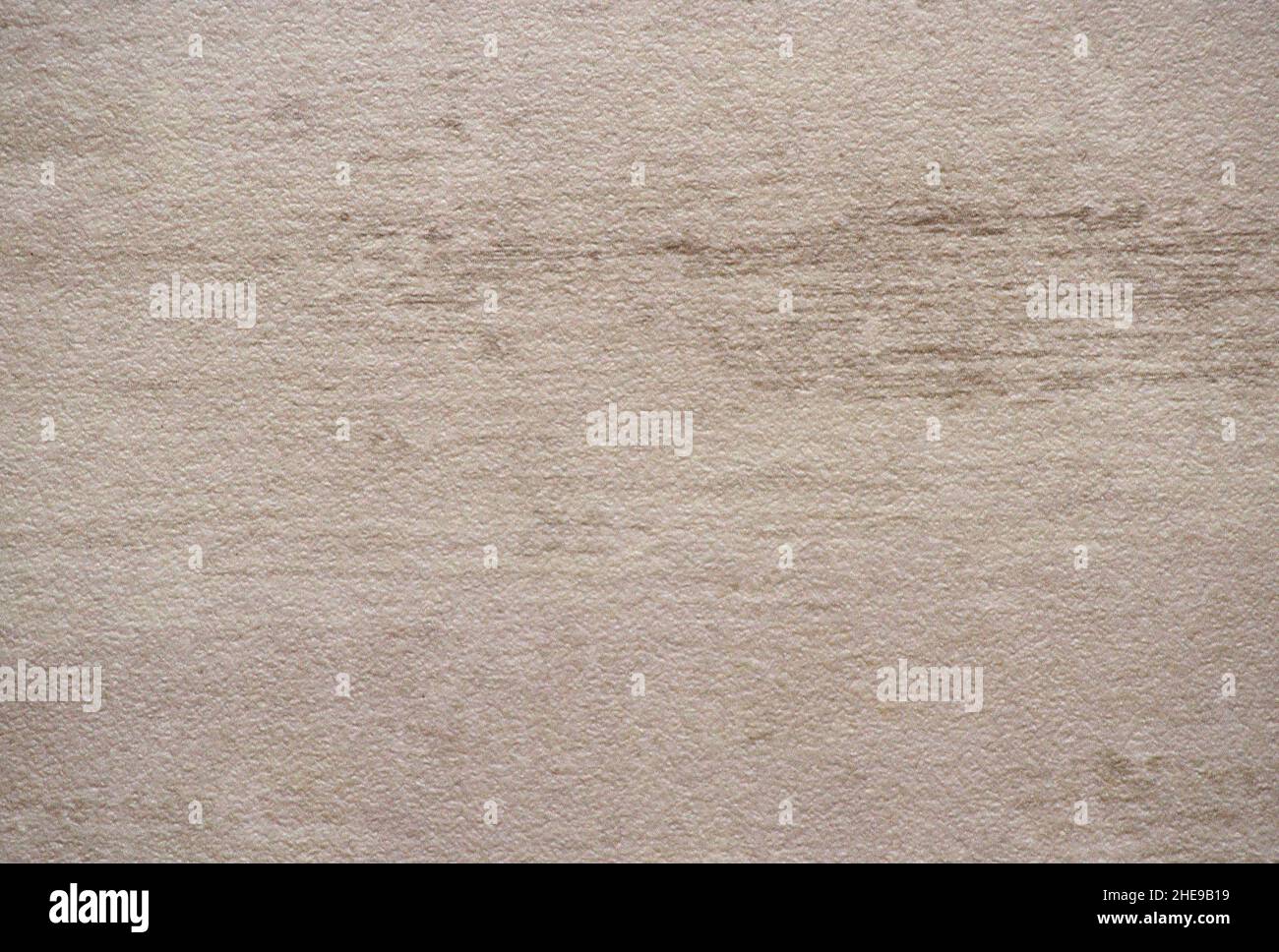 A flat surface of natural light brown stone with a chipped surface ...