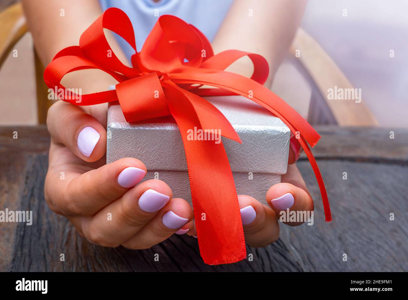 Girls hands holding package hi-res stock photography and images - Alamy