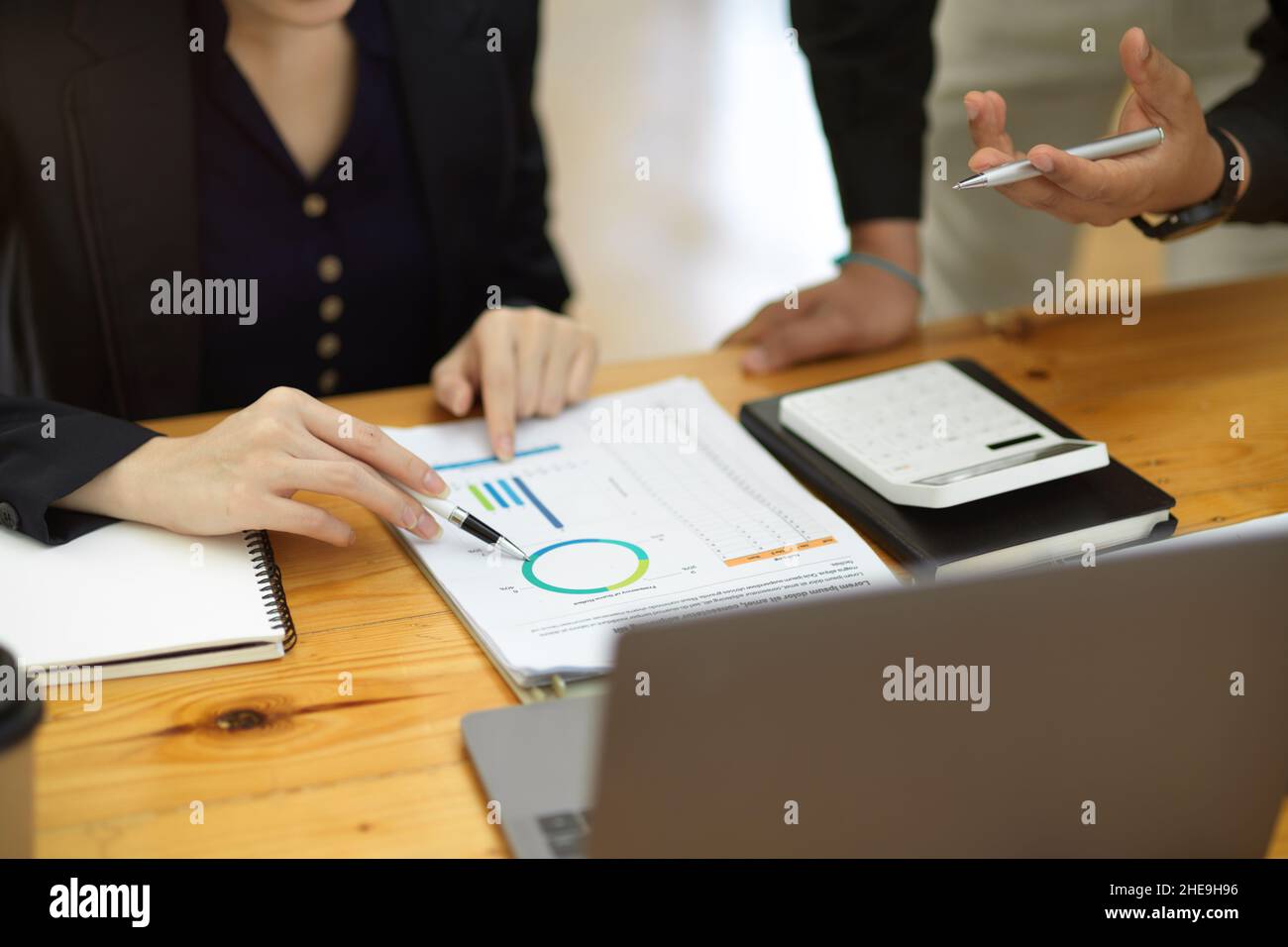Professional businessman training his new female accountant worker in ...