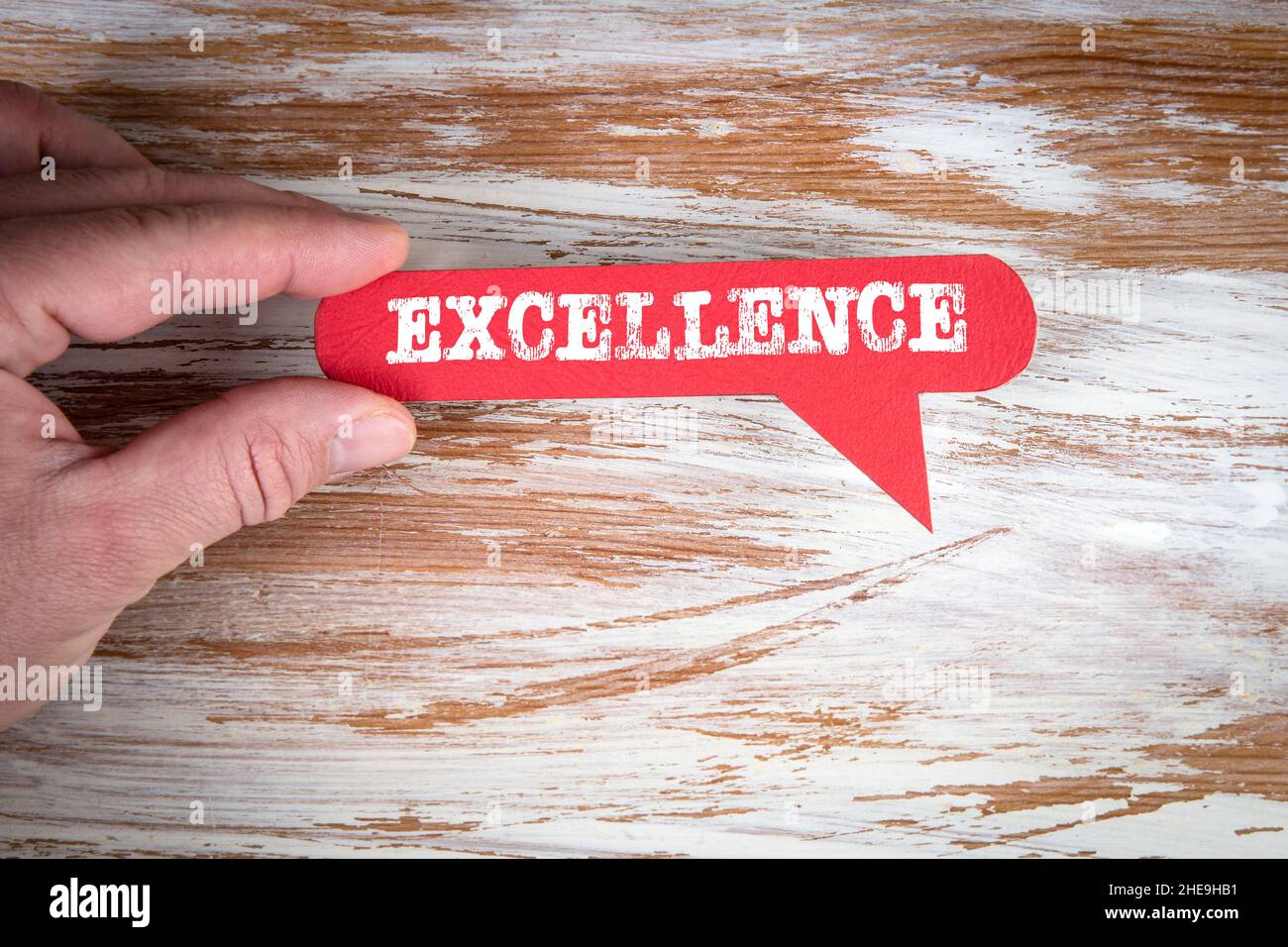 Excellence Concept. Red speech bubble with text Stock Photo - Alamy