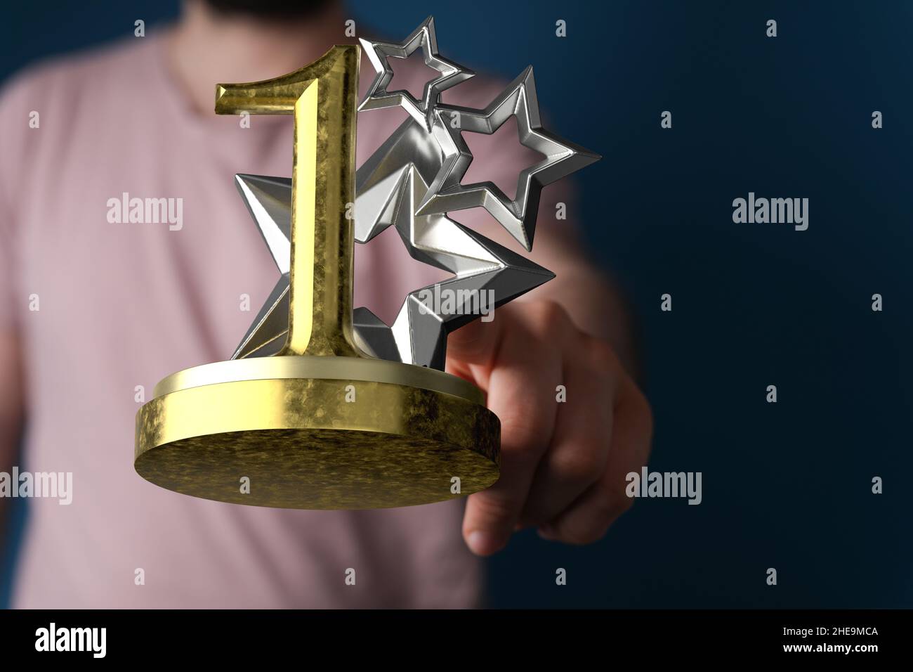 Shallow focus of a human hand holding the first place award ...