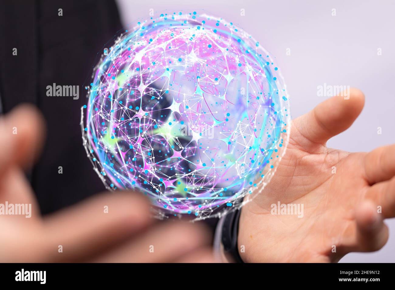 Shallow focus of human hands holding an interconnected globe icon ...